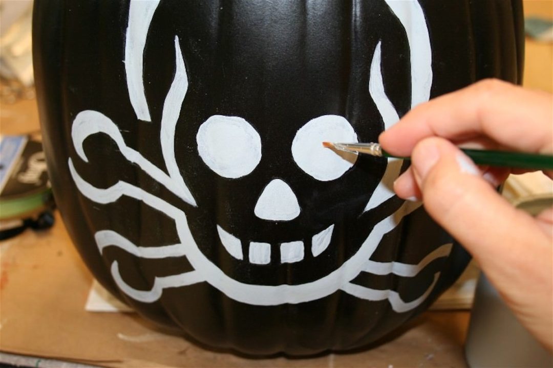 Simple Skeleton Pumpkin with Sparkle - Mod Podge Rocks